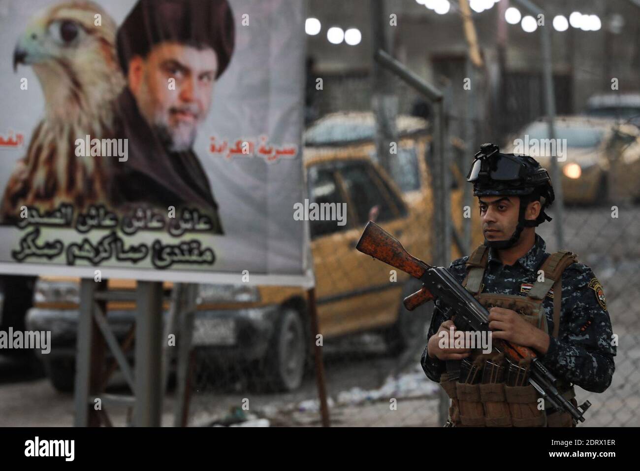 Baghdad, Iraq. 21st Dec, 2020. An Iraqi police officer stands guard ...