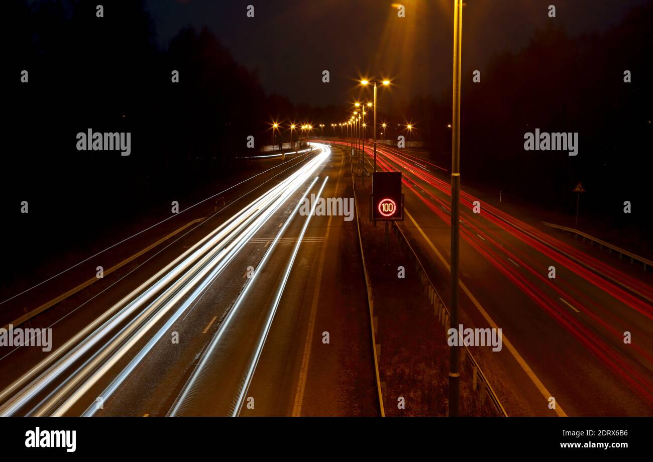 Traffic lights on highway in night time Stock Photo - Alamy