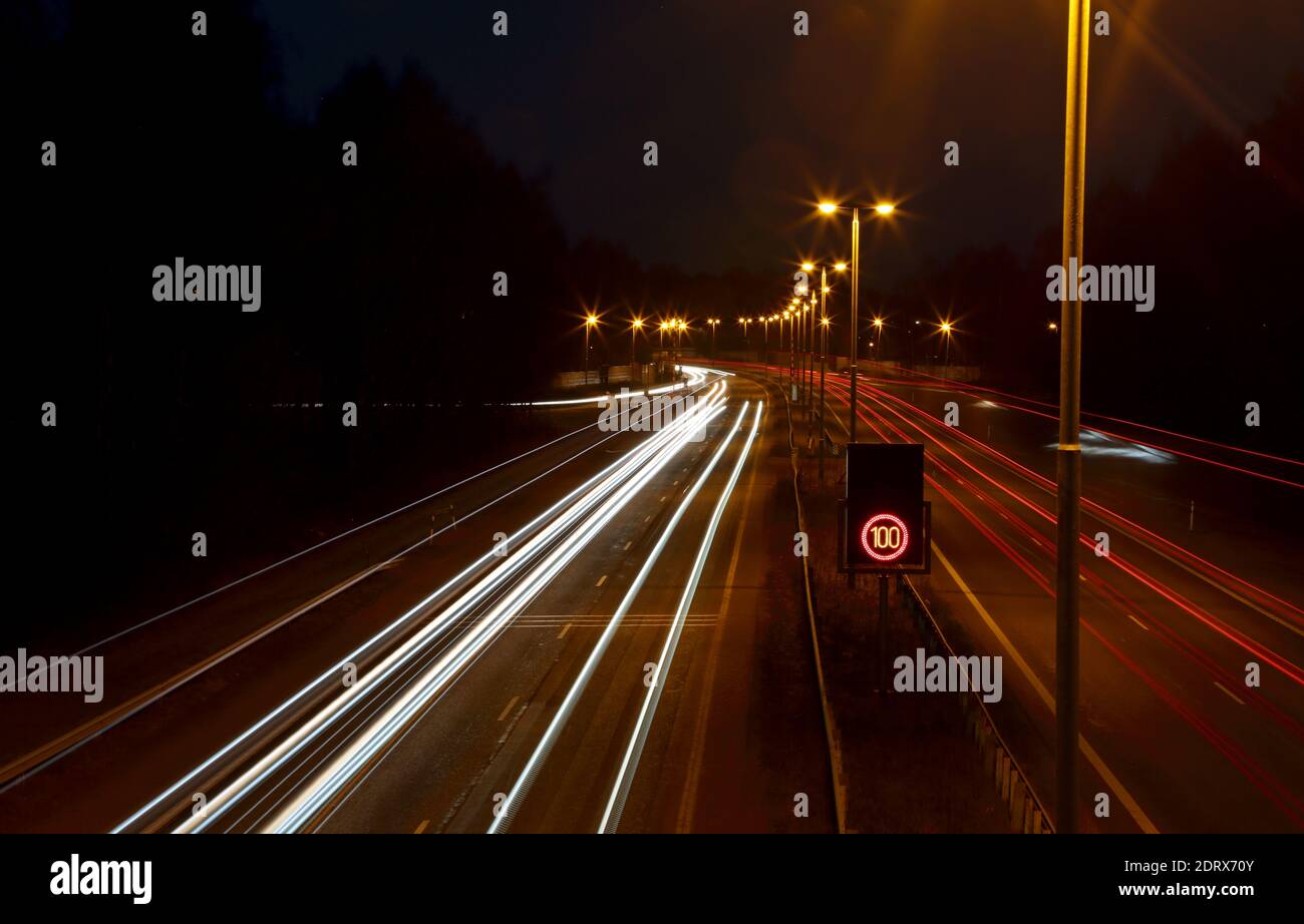 Traffic lights on highway in night time Stock Photo - Alamy
