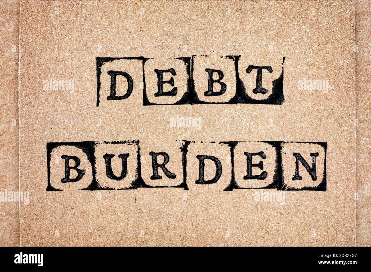 Cardboard with words Debt Burden made by black alphabet stamps Stock ...