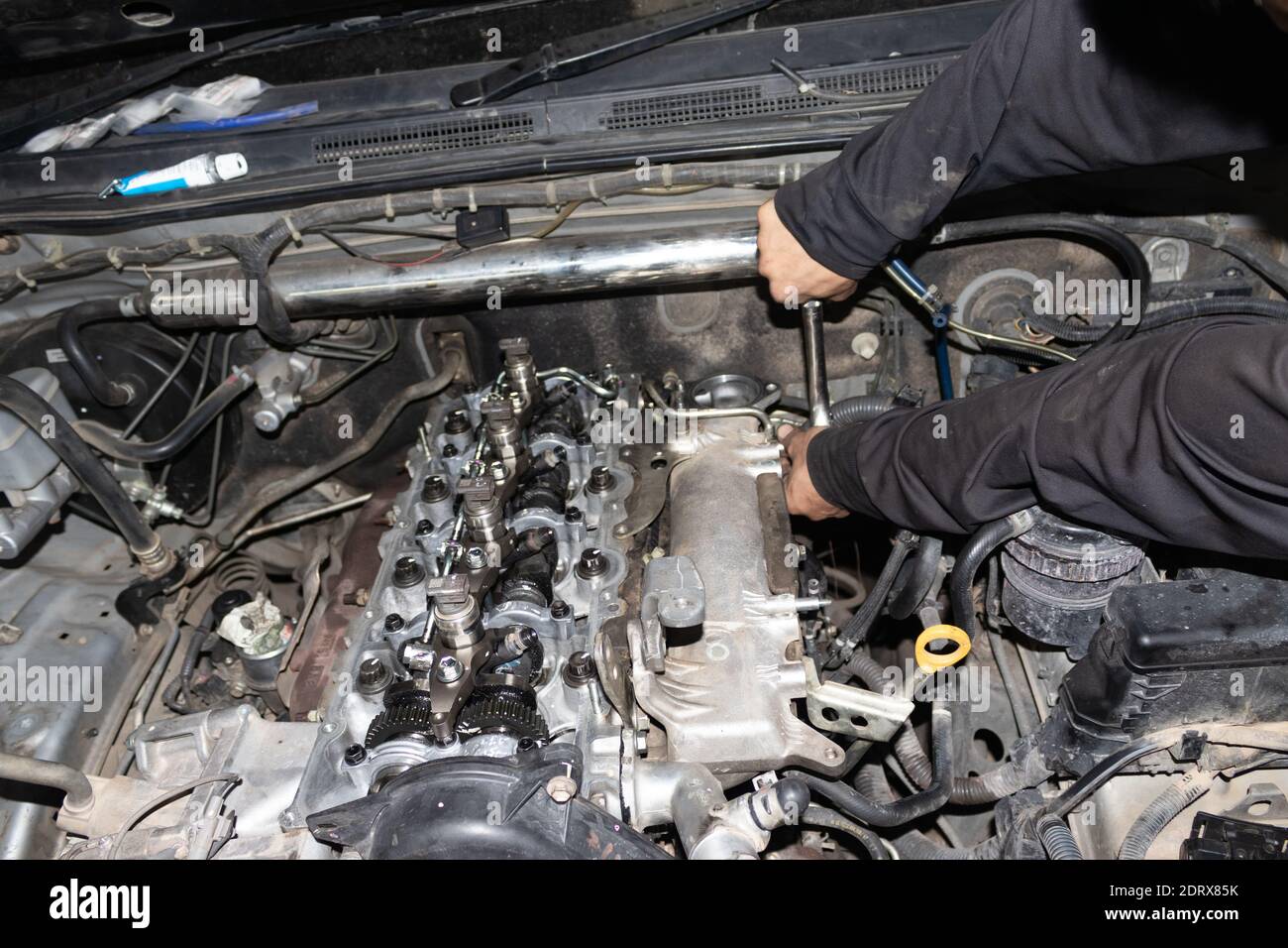 The Mechanic Is Checking The Engine Stock Photo - Alamy