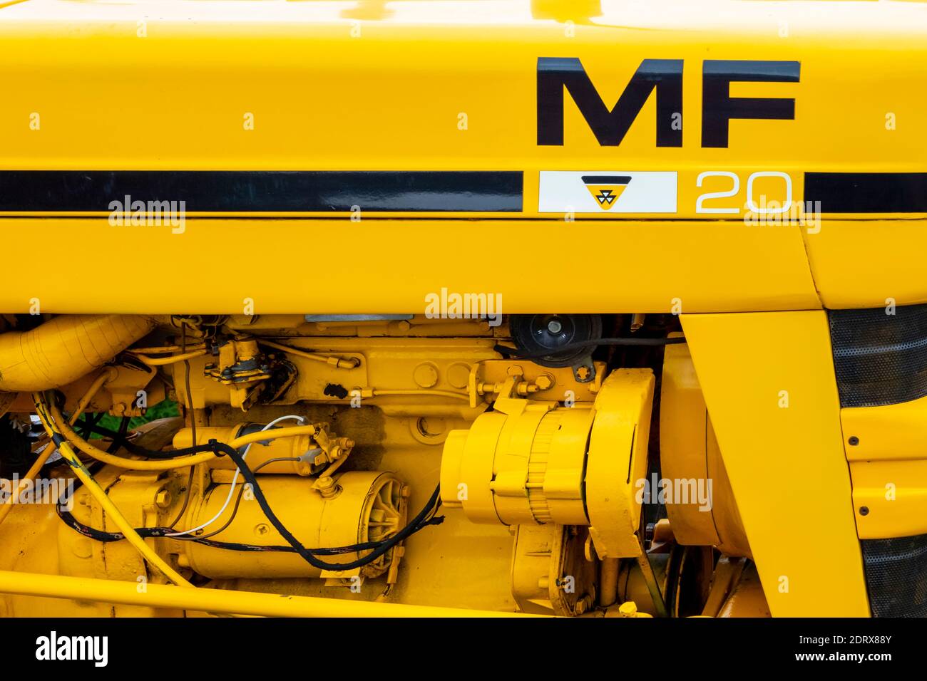 Name on the engine cover of a restored and repainted yellow Massey ...