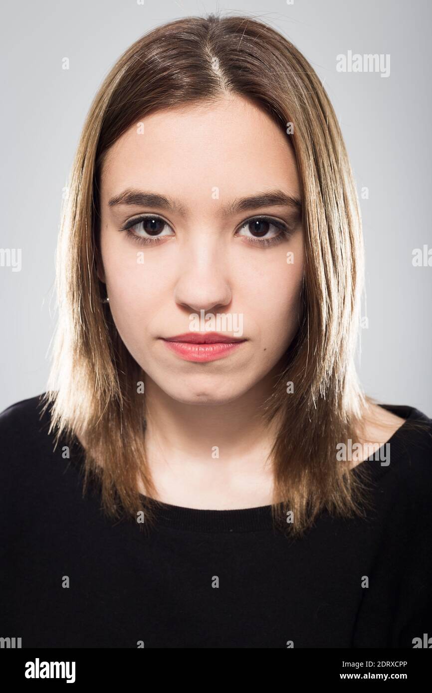 Expressive portrait of girl with neutral background Stock Photo - Alamy