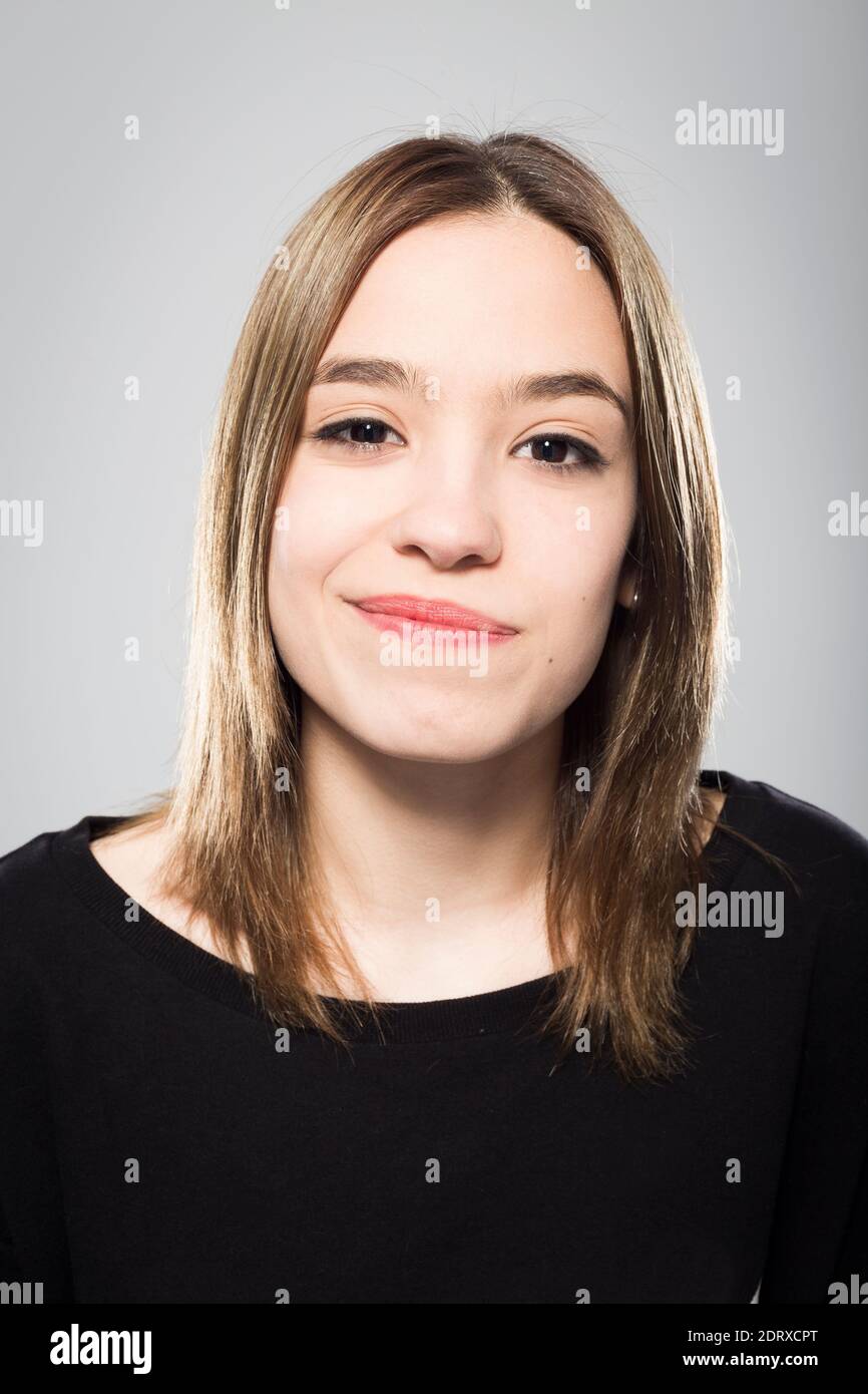 Expressive portrait of girl with neutral background Stock Photo - Alamy