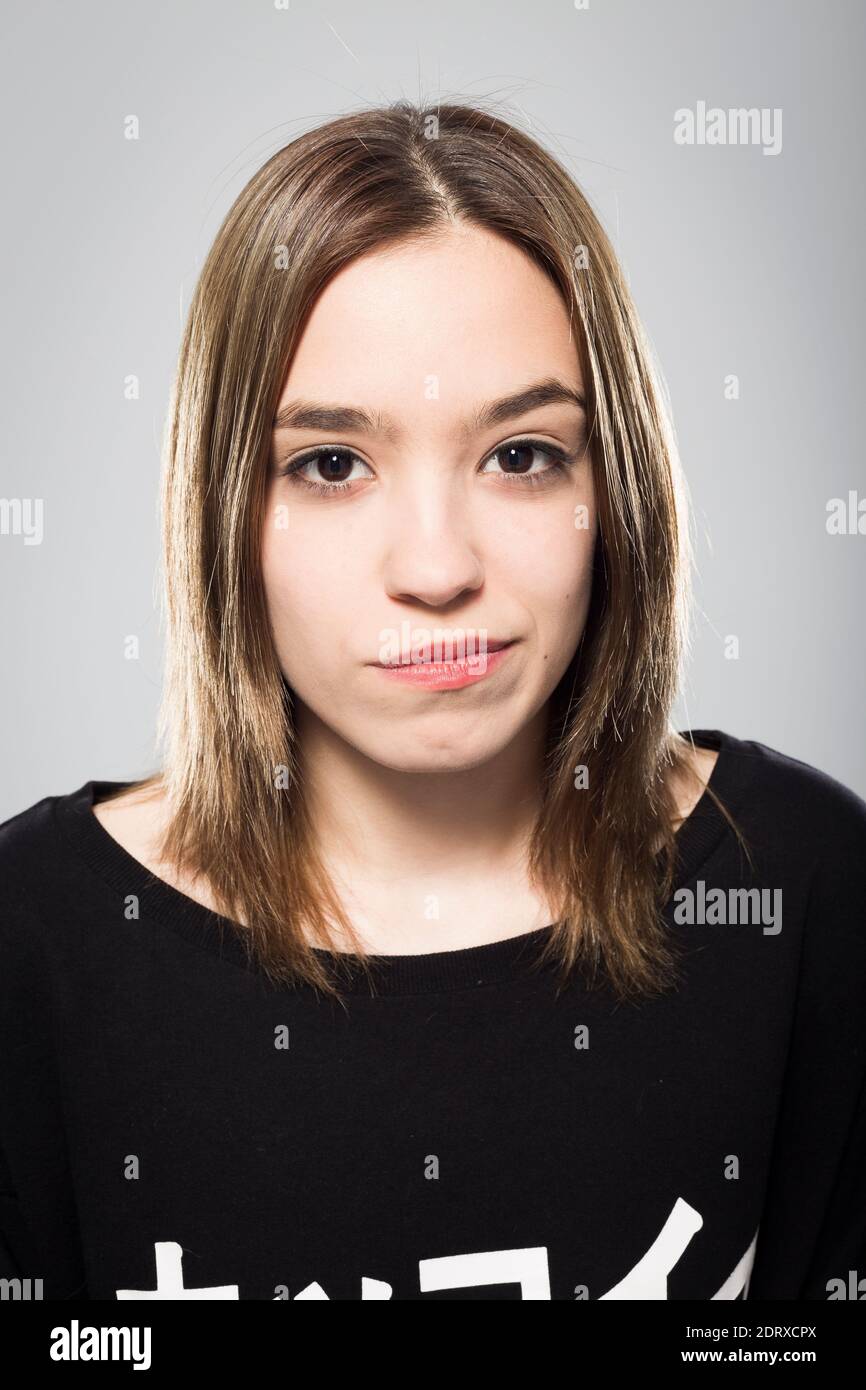 Expressive portrait of girl with neutral background Stock Photo - Alamy