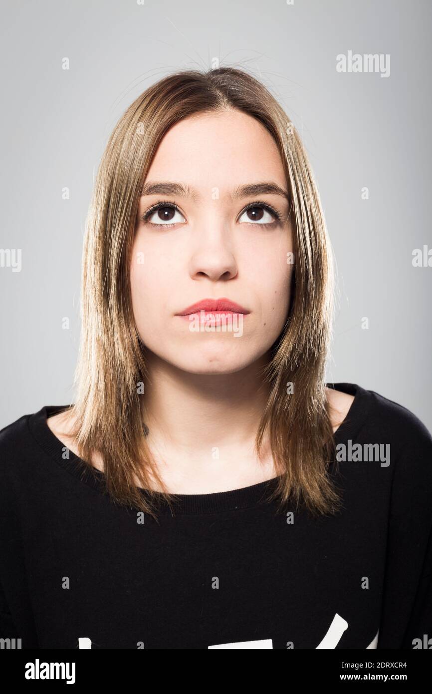 Expressive portrait of girl with neutral background Stock Photo - Alamy