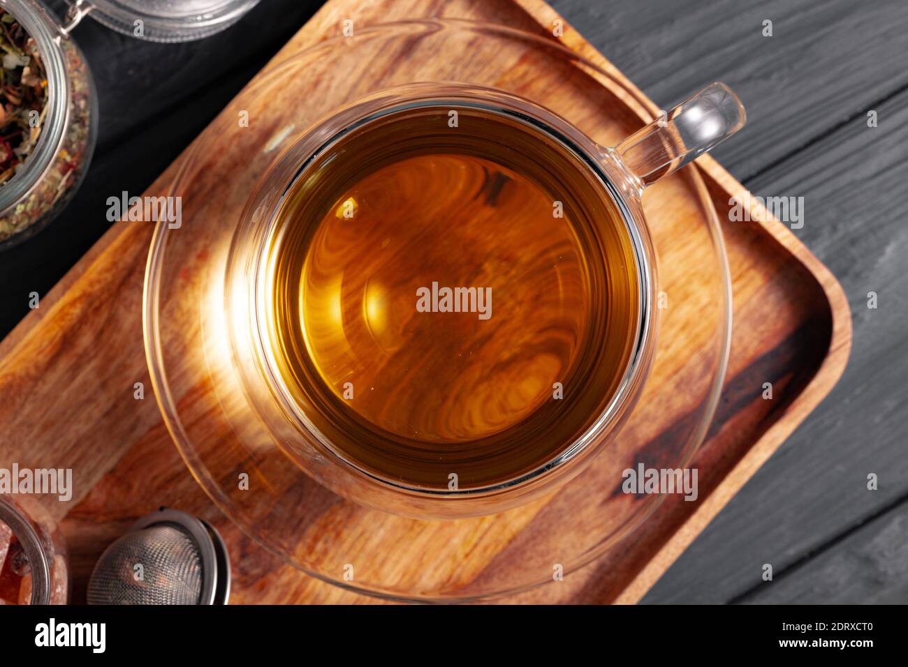 Glass cup of tea on wooden board Stock Photo - Alamy
