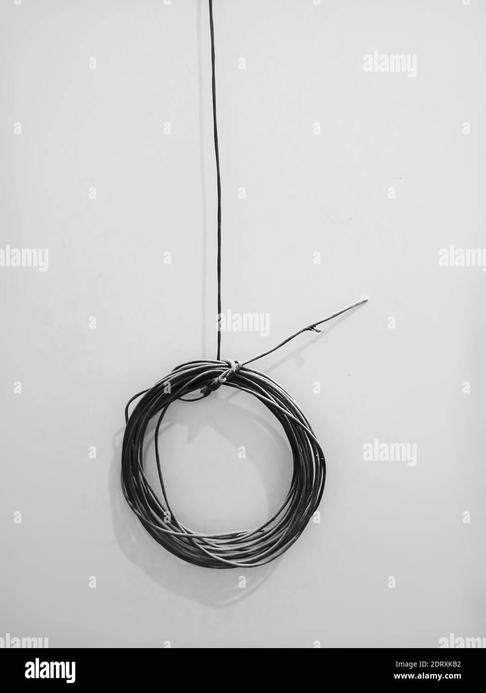 Cables hanging Black and White Stock Photos & Images - Alamy
