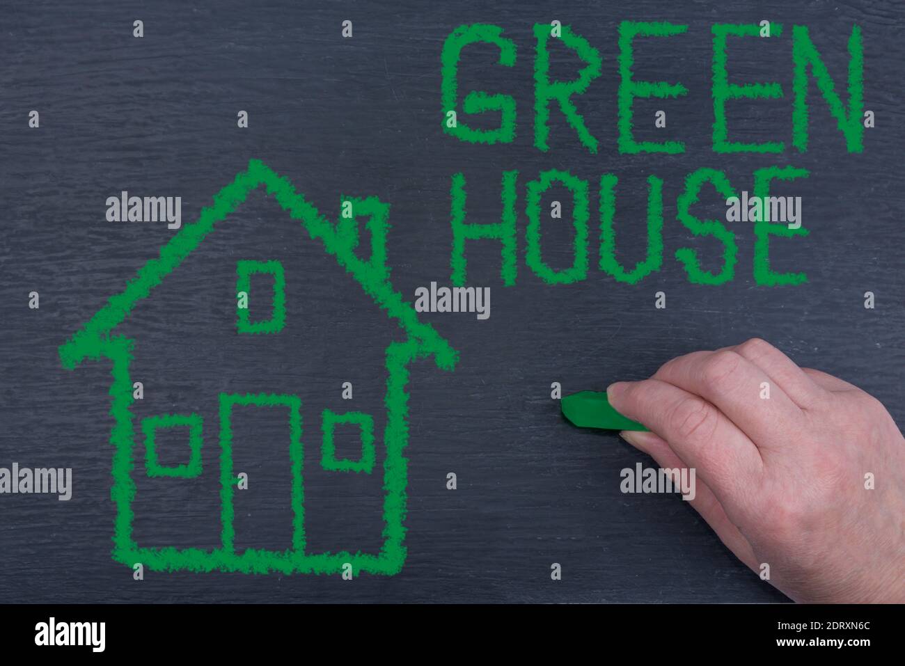 Green house sign on a chalkboard. Environmental concept Stock Photo - Alamy