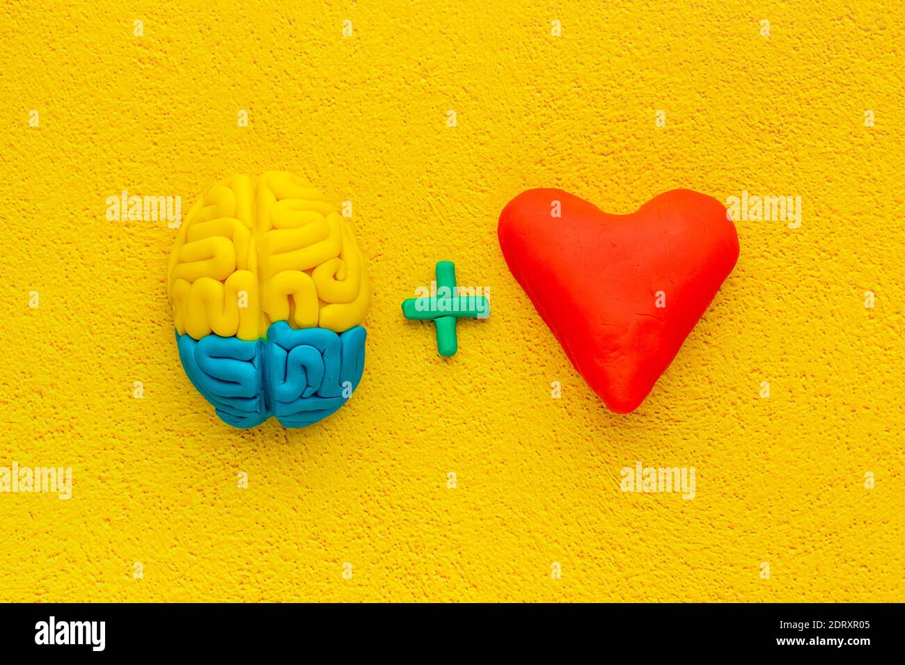 Think with love - heart and brain concept, top view Stock Photo - Alamy