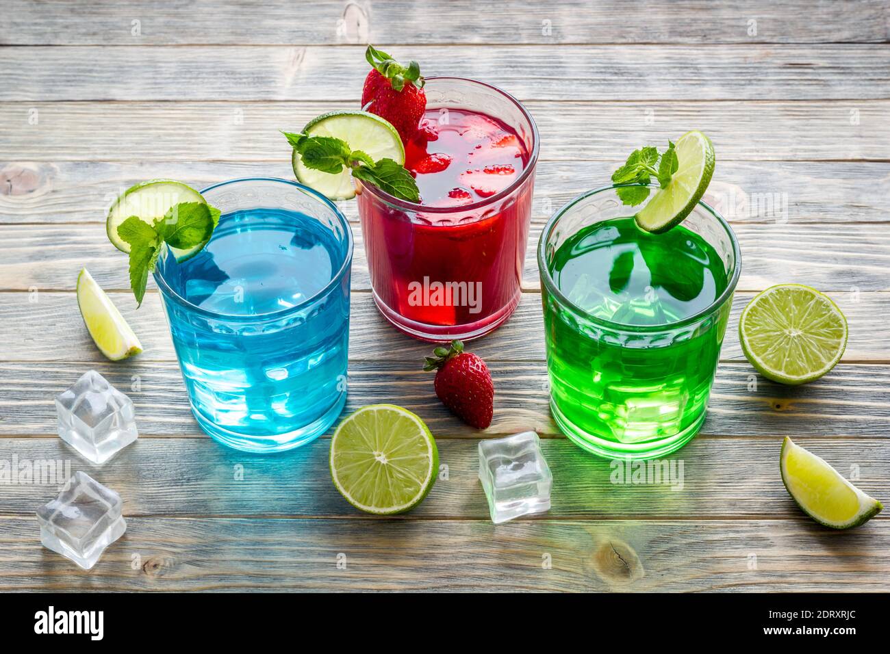 Cold green, blue and red cocktails with fresh fruits and mint Stock ...