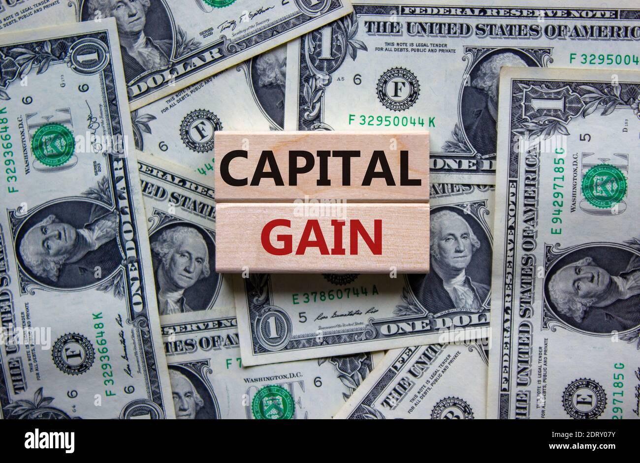 Capital gain symbol. Concept words 'Capital gain' on wooden blocks on a ...