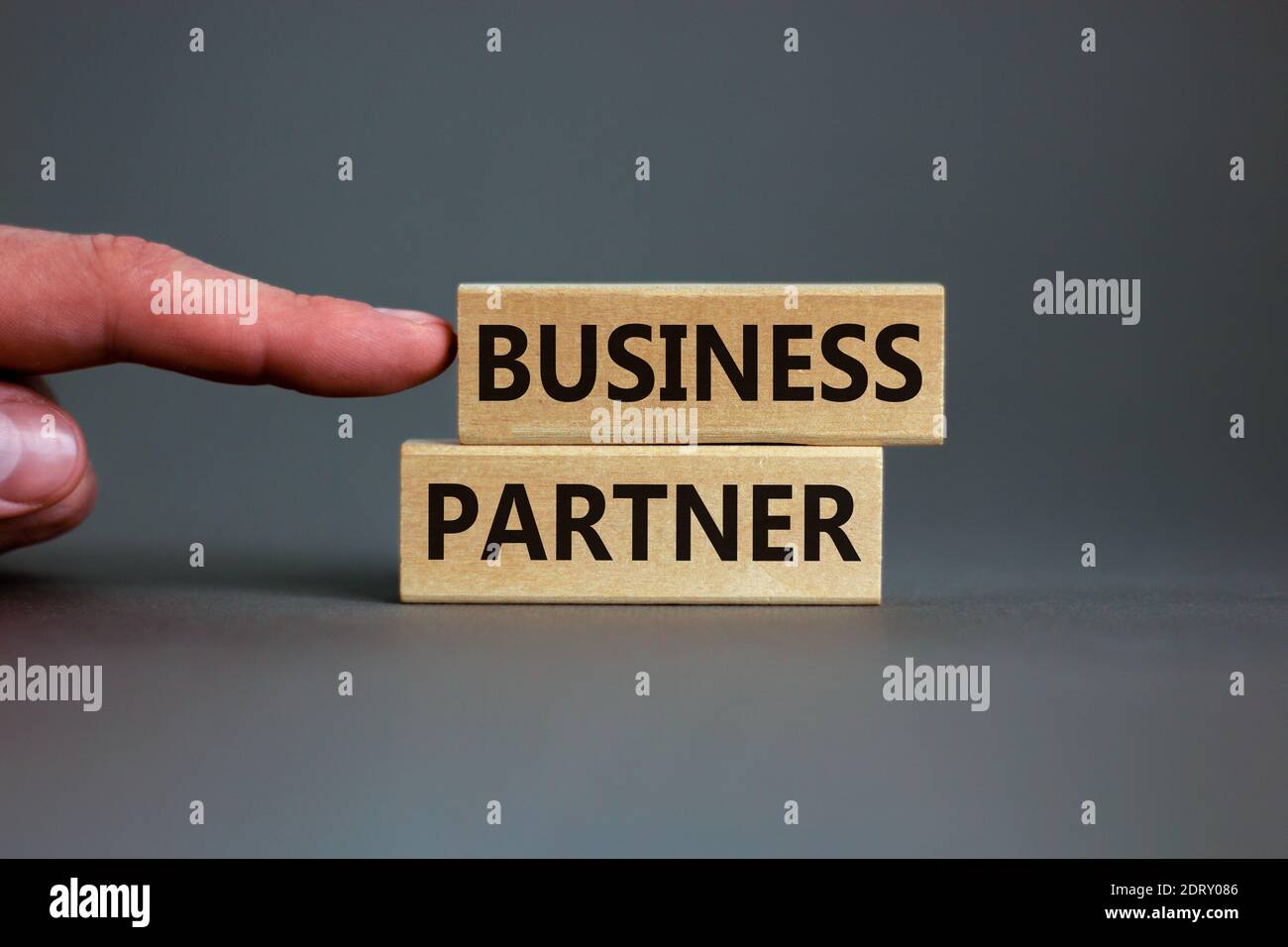Business partner symbol. Wooden blocks with words 'business partner' on ...
