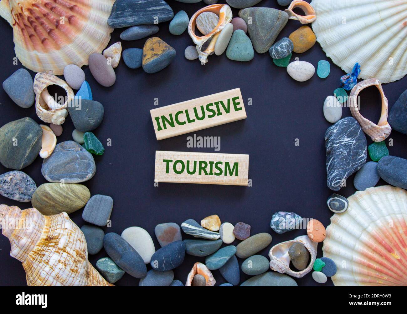 Inclusive tourism symbol. Words 'Inclusive tourism' on wooden blocks on ...