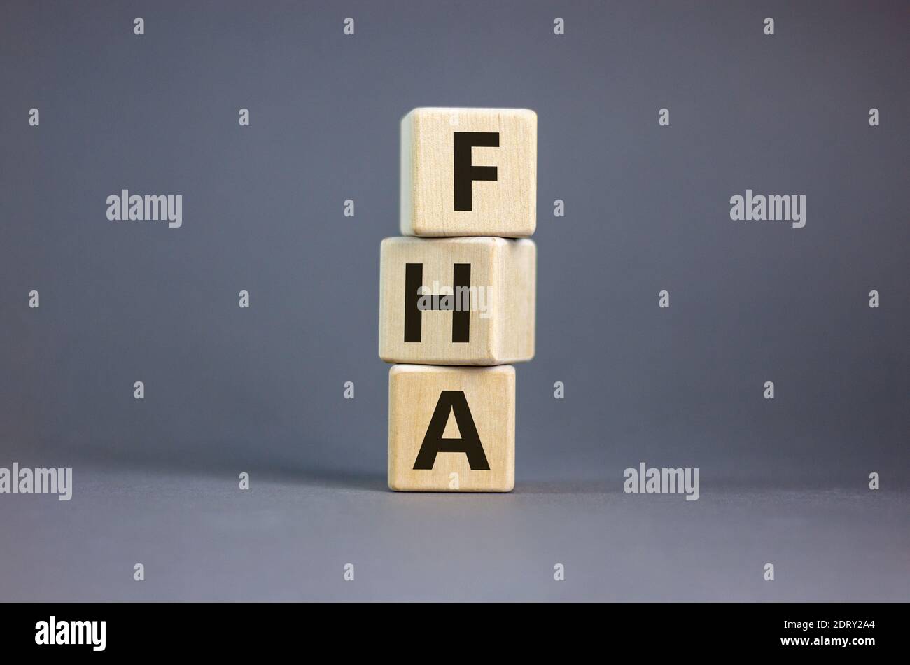 FHA symbol. Wooden cubes form the word 'FHA, federal housing ...