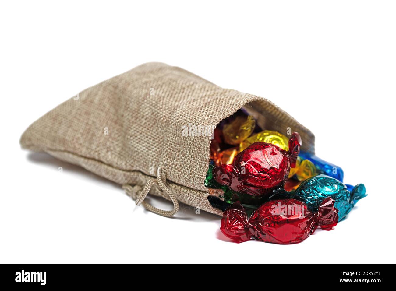 Candies wrapped in colored foil in a jute bag Stock Photo - Alamy