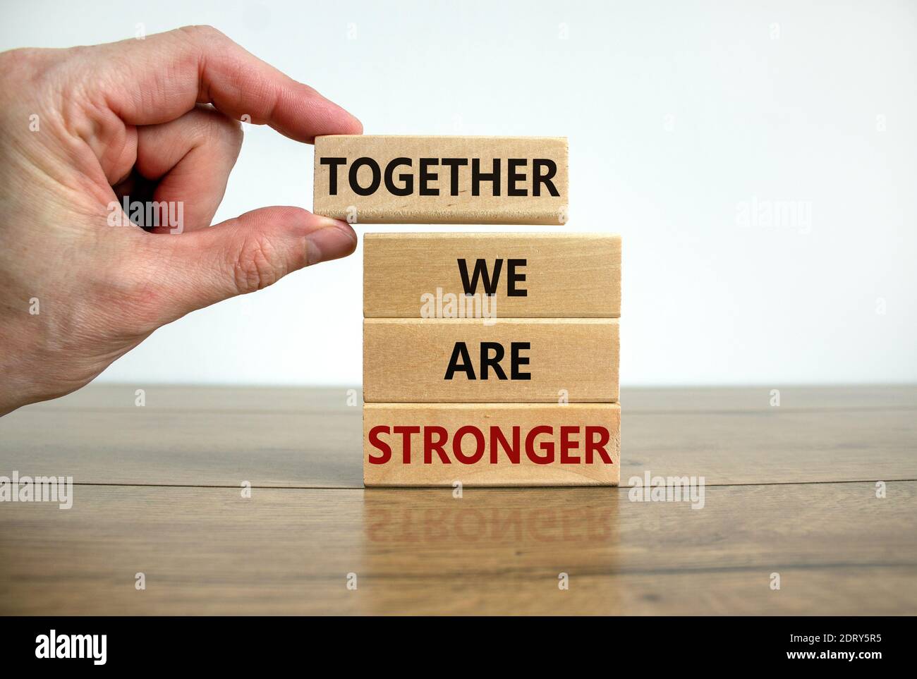 Together we are stronger symbol. Wooden blocks with words 'together we ...