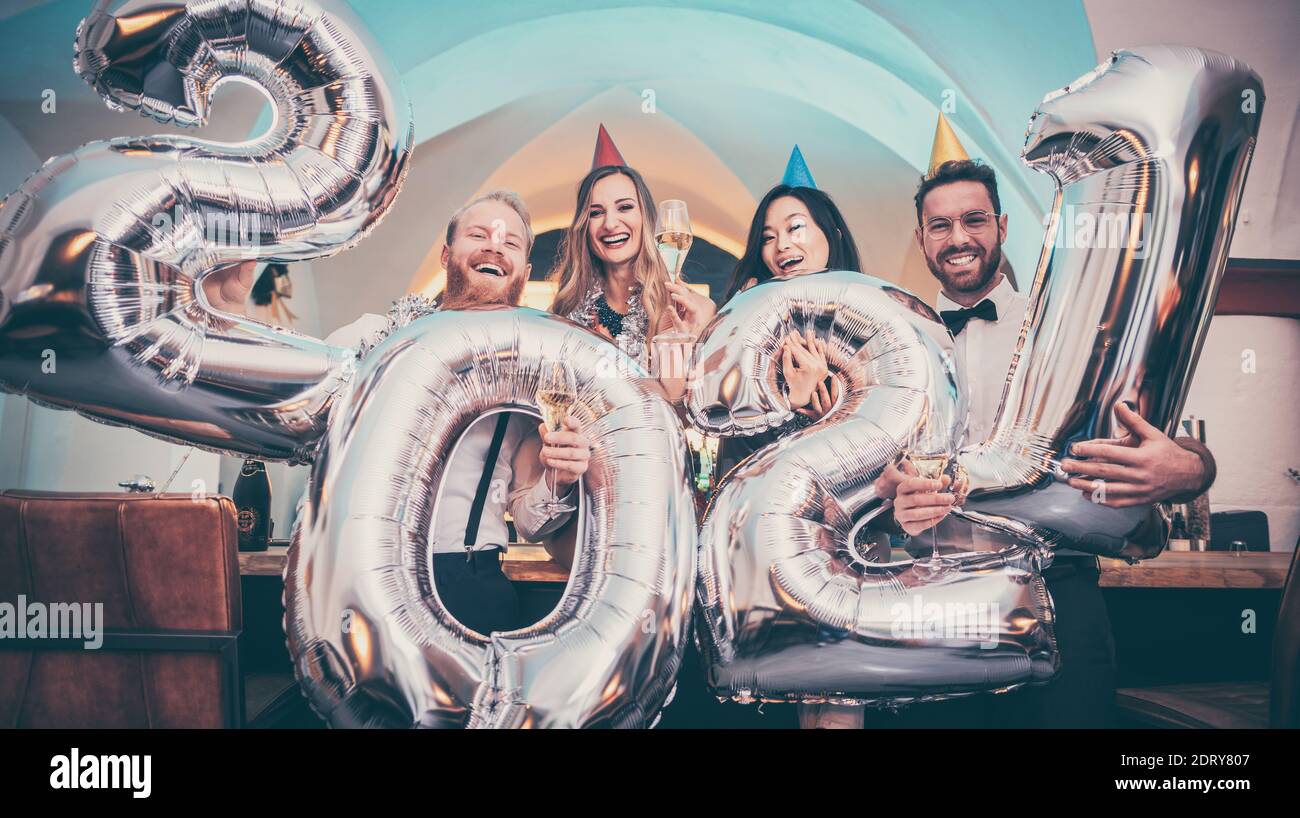 Group of party people celebrating the arrival of 2021 Stock Photo - Alamy