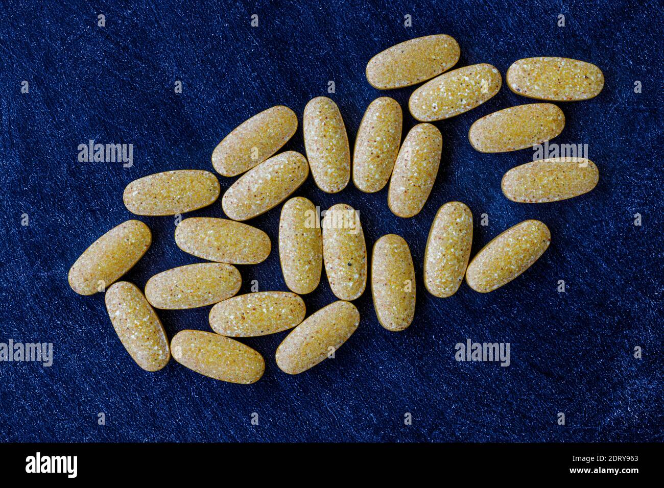 close-up of multivitamin and mineral supplement tablets. dietary ...