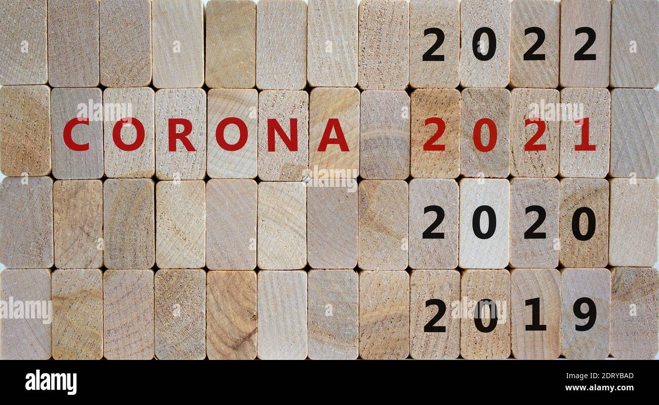 Symbol of covid-19 pandemic in 2021. Wooden blocks form the words ...