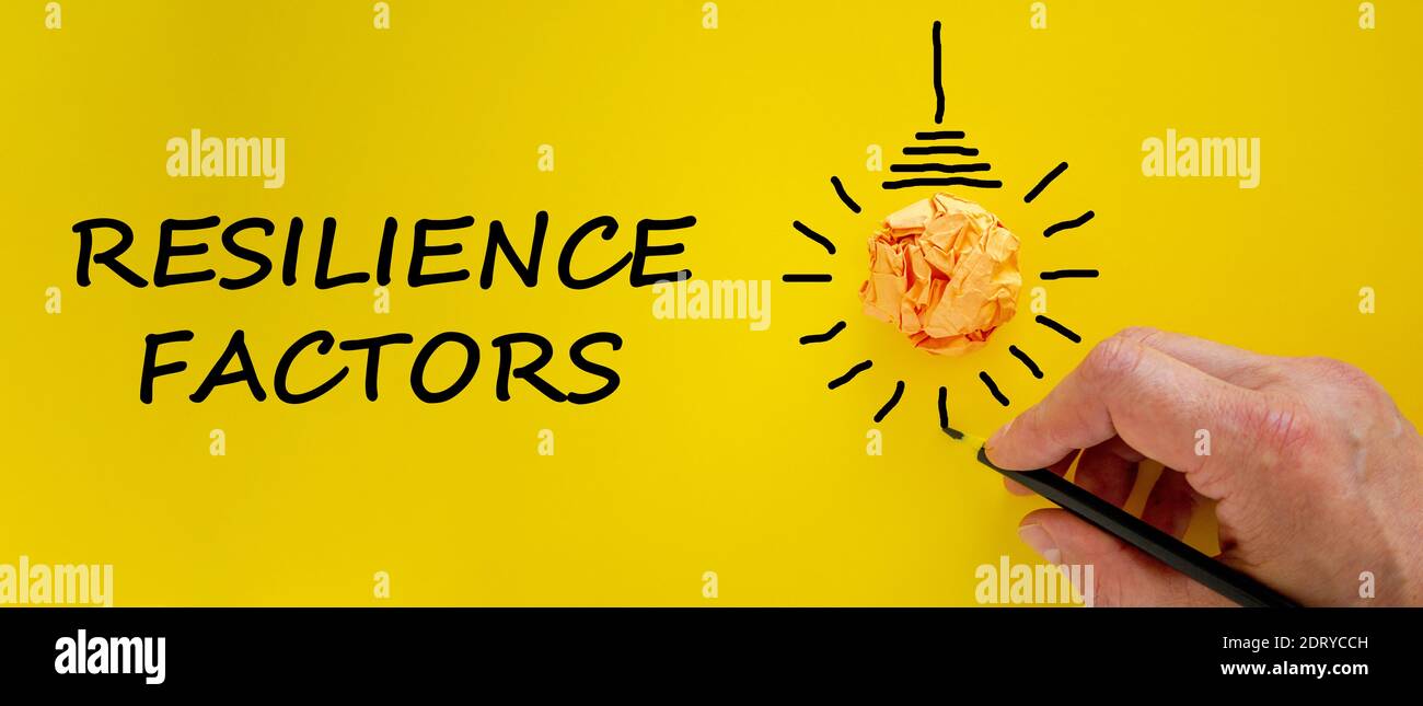 Resilience factors symbol. Male hand with black pencil writing ...
