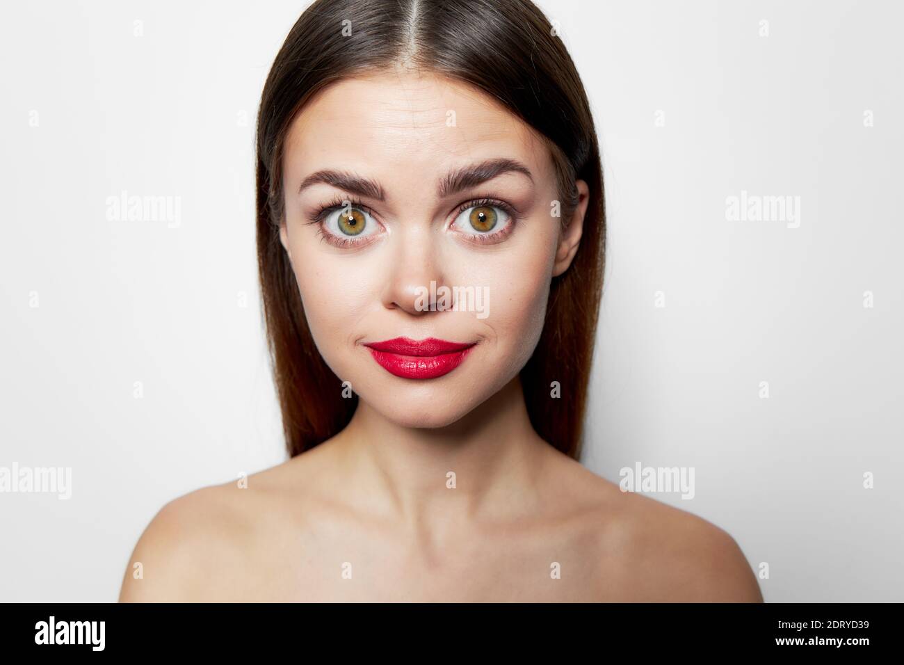 Woman close-up with wide open eyes red lips Stock Photo - Alamy