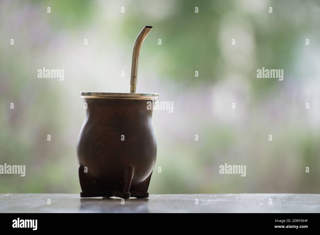 Selective focus shot of a calabash mate cup with straw - yerba mate tea ...