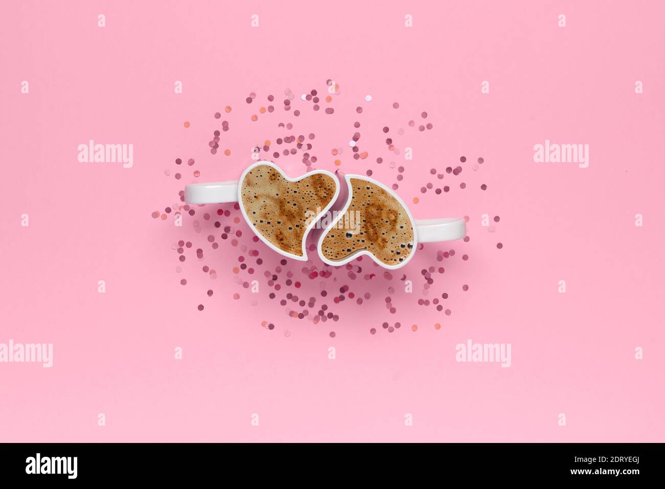 Cups with coffee and confetti on pink background. Valentine day ...