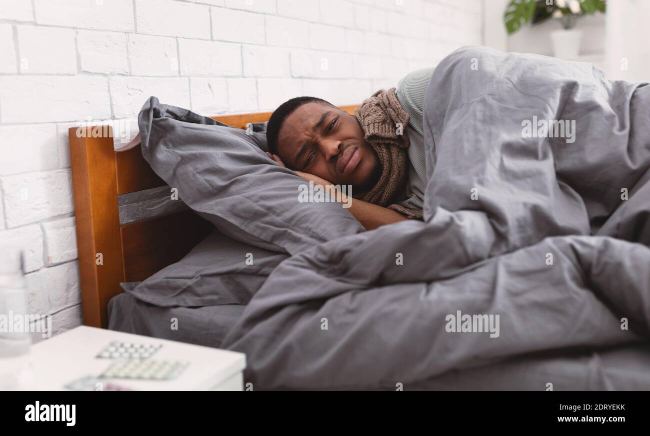 Sick male wrapped in blanket hi-res stock photography and images - Alamy