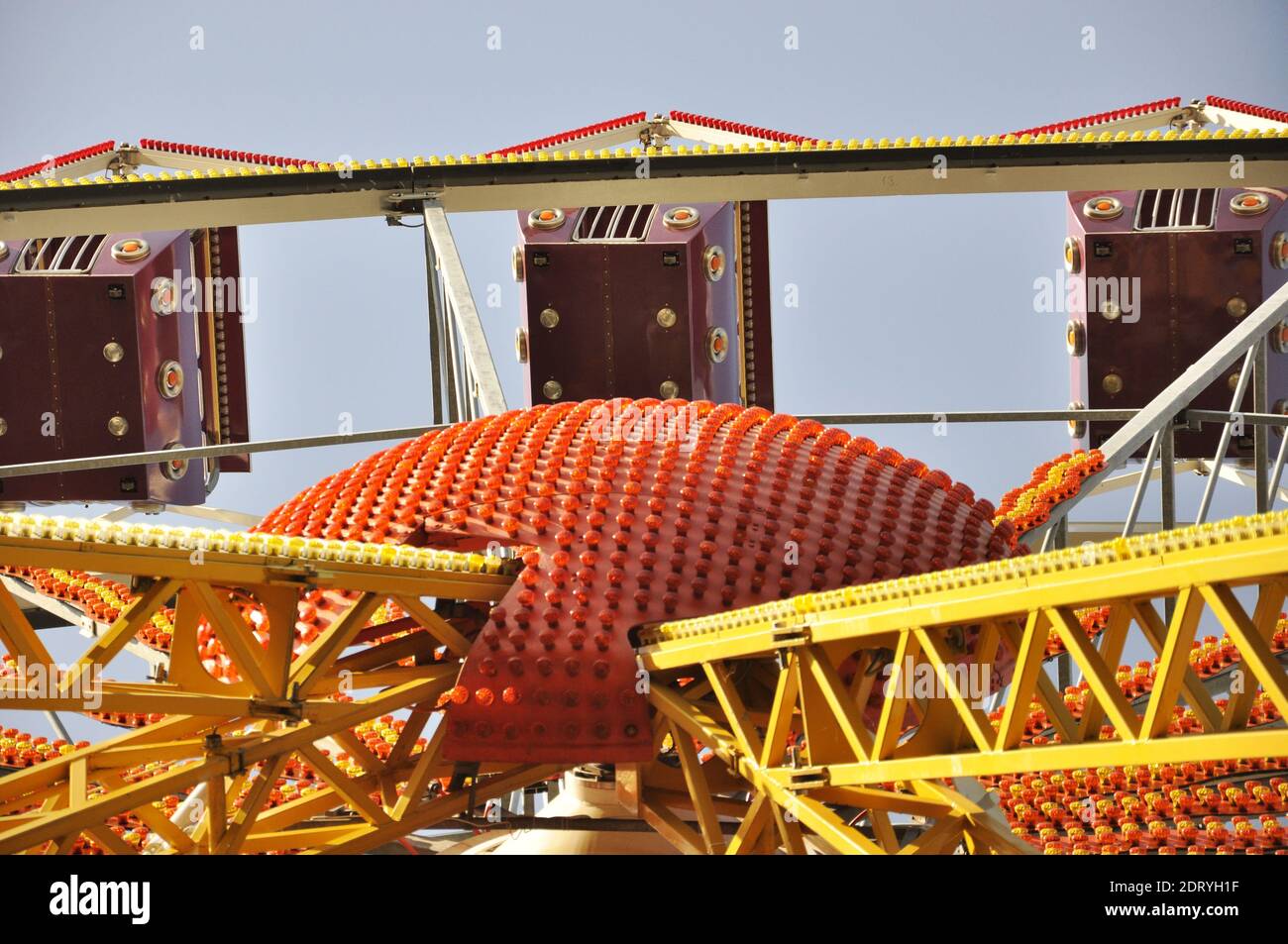 Yellow ferris wheel in an amusement park Stock Photo - Alamy