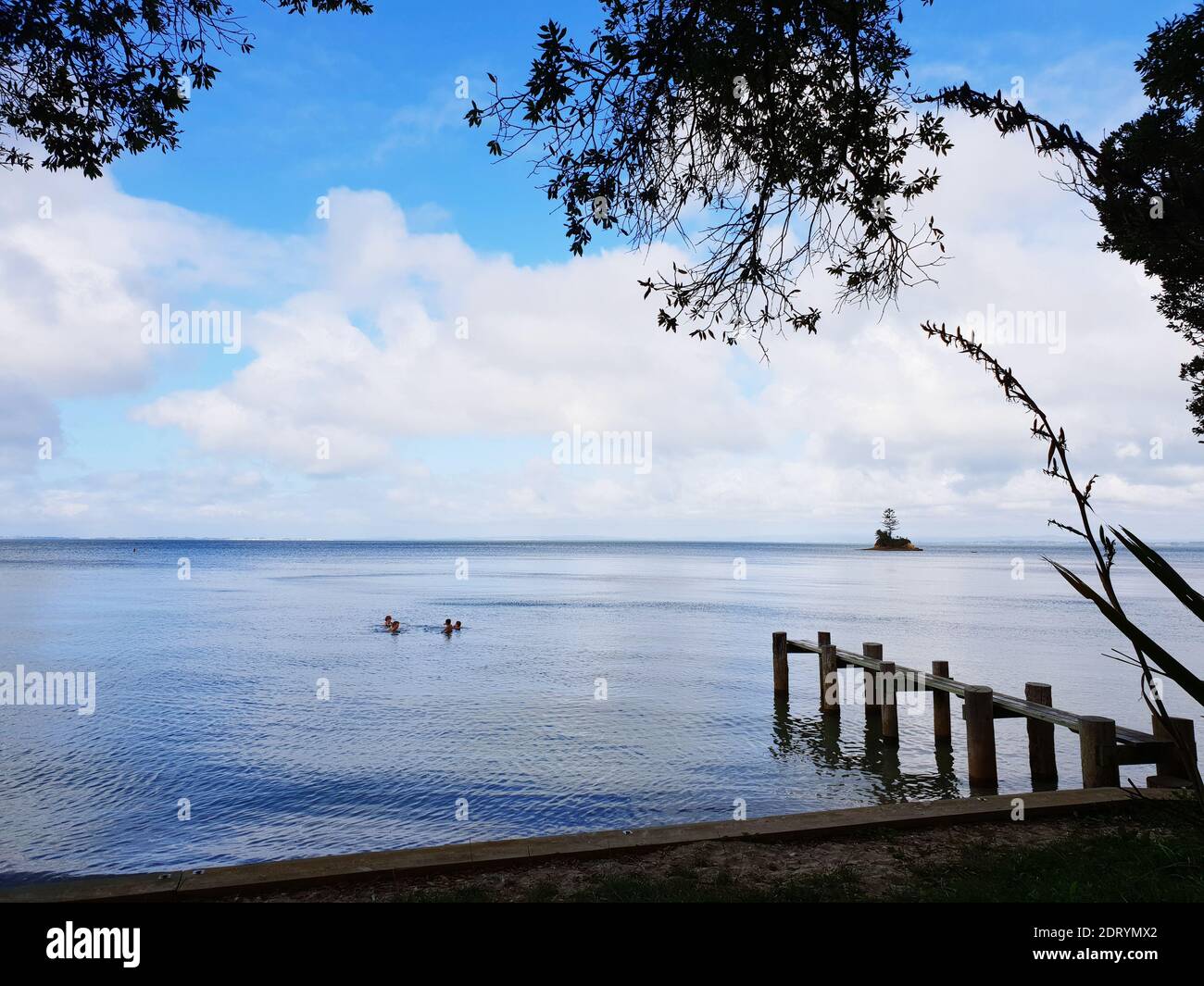 Family Swim In Lagoon Stock Photo - Alamy