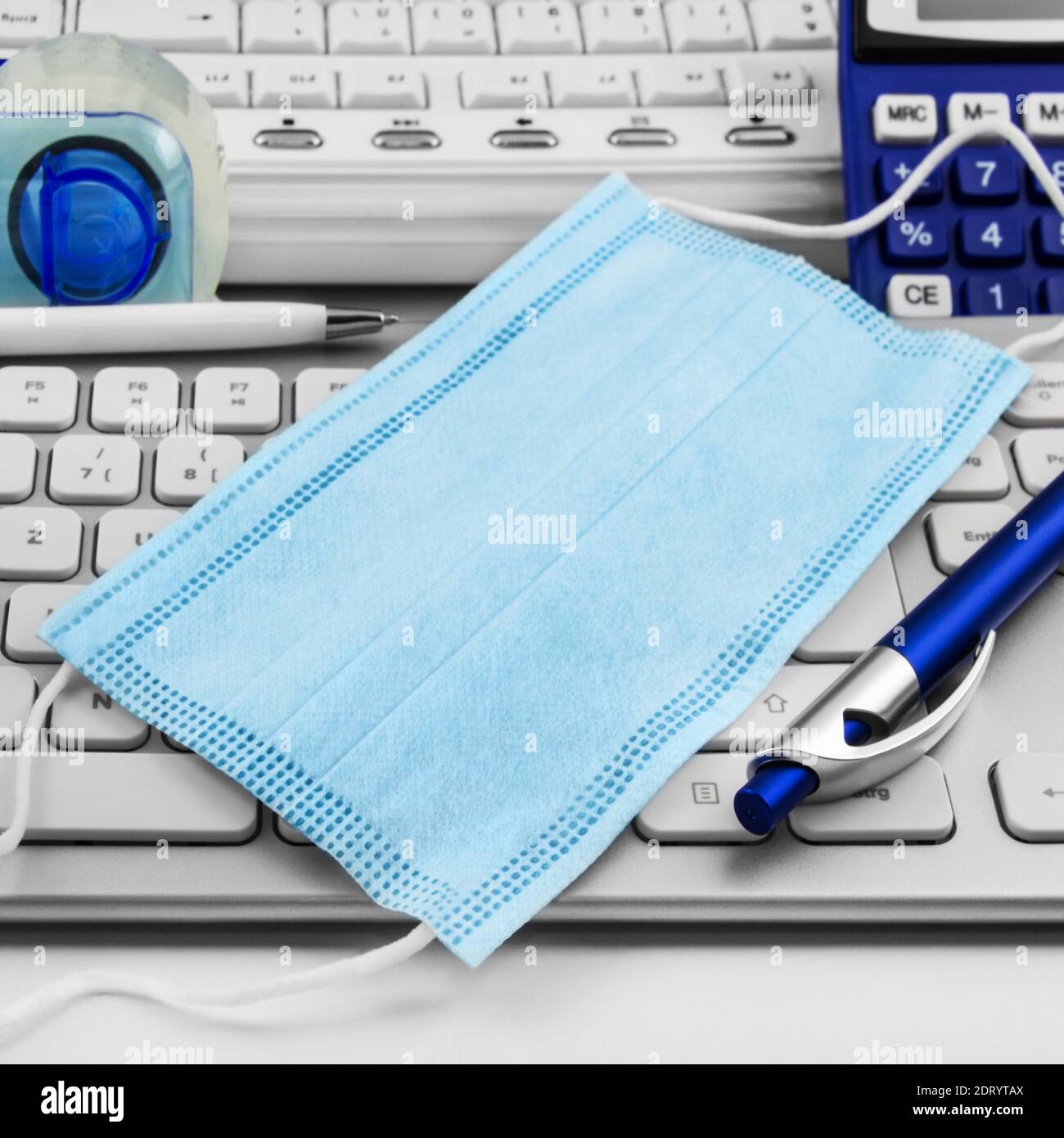 Face mask and office background with PC keyboard Stock Photo - Alamy