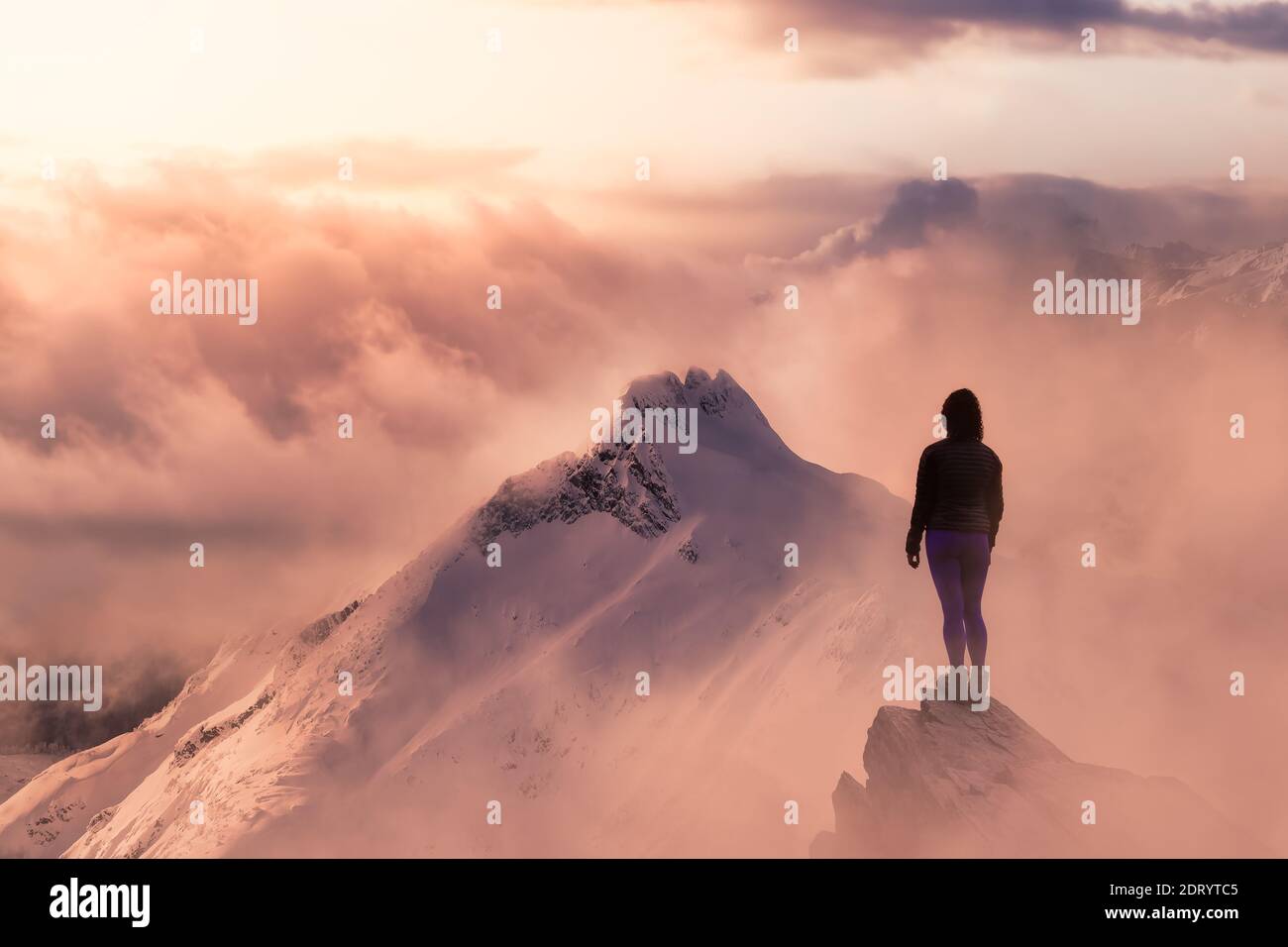 Fantasy Adventure Composite with a Girl on top of a Mountain Cliff ...
