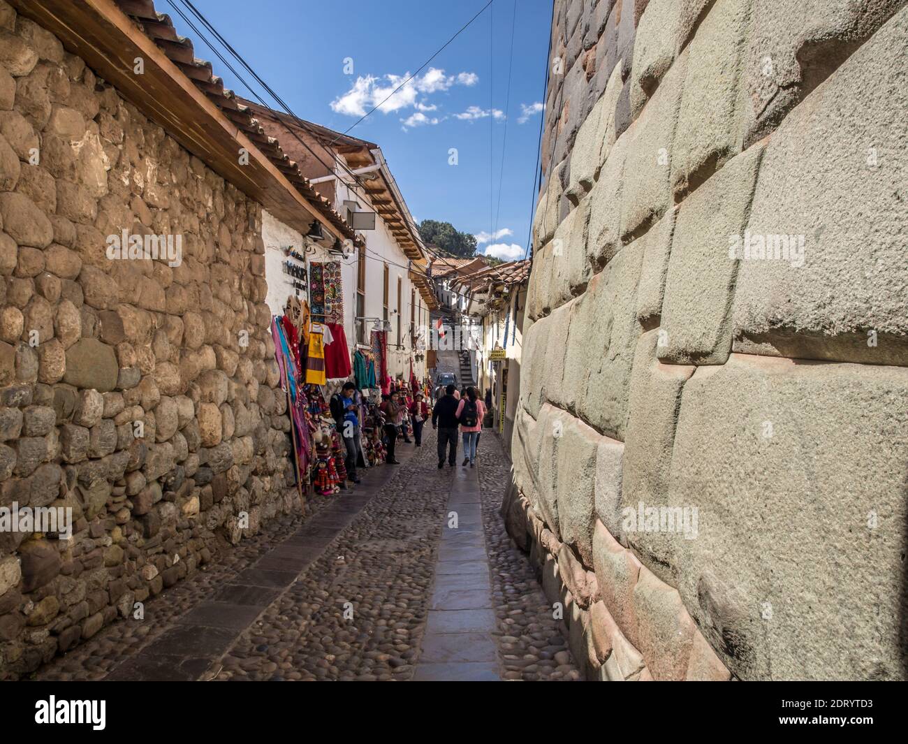 Cusco, Peru - May 18, 2016: Narrow street of Cusco with stone houses ...