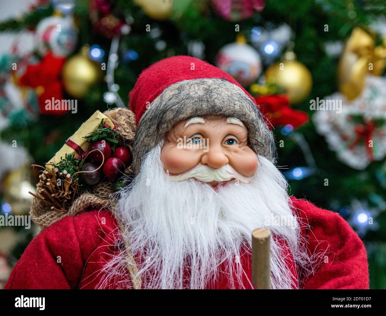 My Father Christmas in front of decorated tree Stock Photo - Alamy
