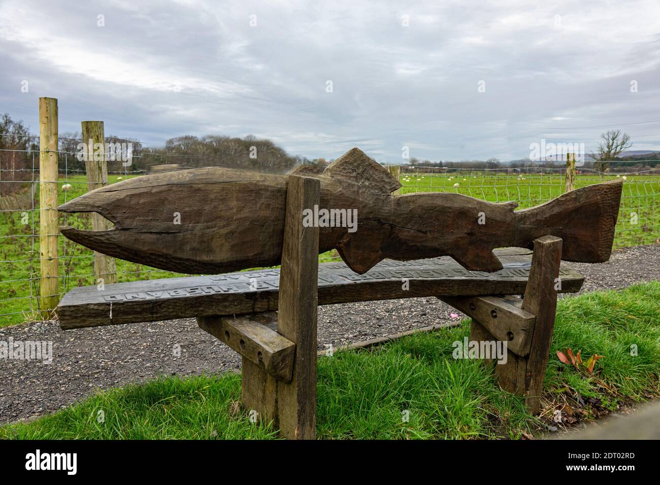 Memorial bench made in the shape of a fish Stock Photo - Alamy