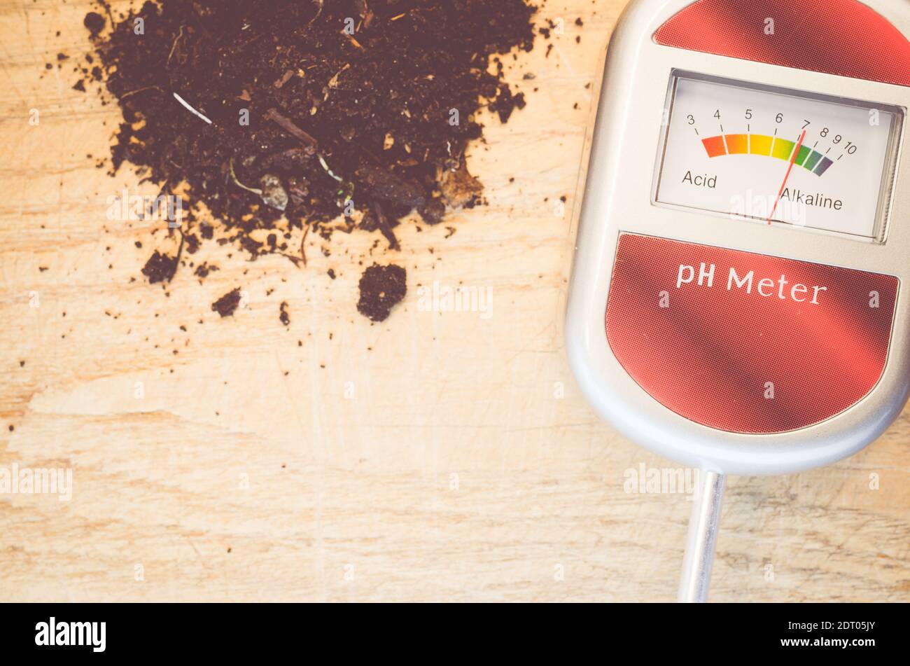 A top view of an analog tool to measure soil on a wooden table Stock ...