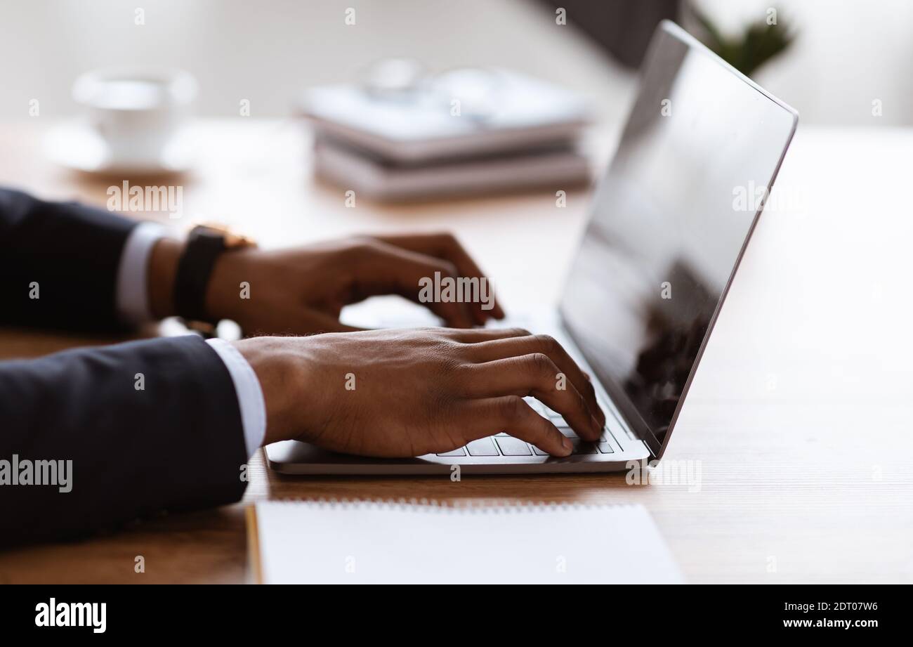 Side view african man typing hi-res stock photography and images - Alamy