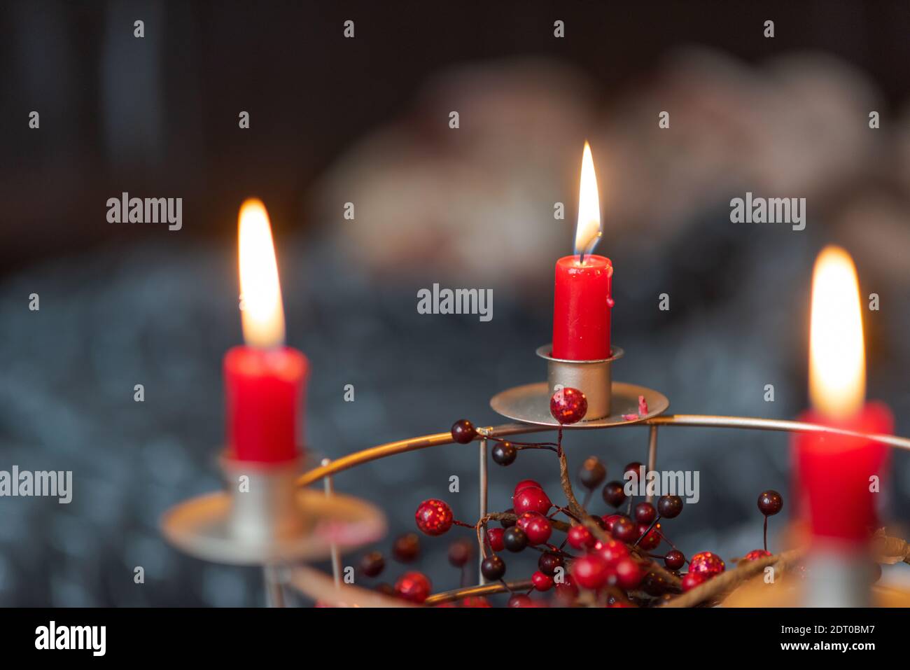 Red candles burning on selfmade Advent wreath made of wire grid ...