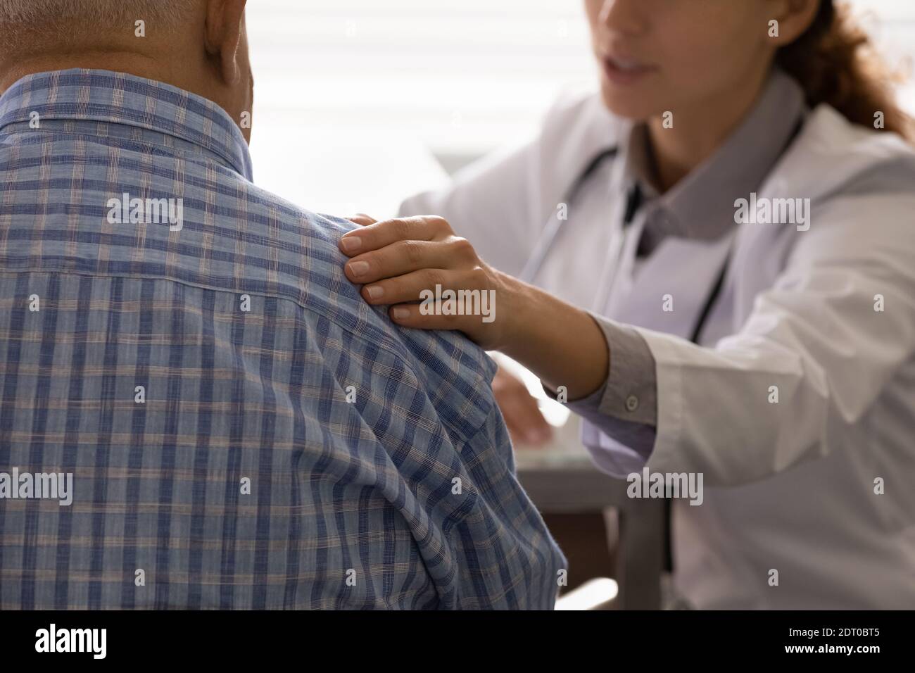 Close up of female doctor support mature patient Stock Photo - Alamy