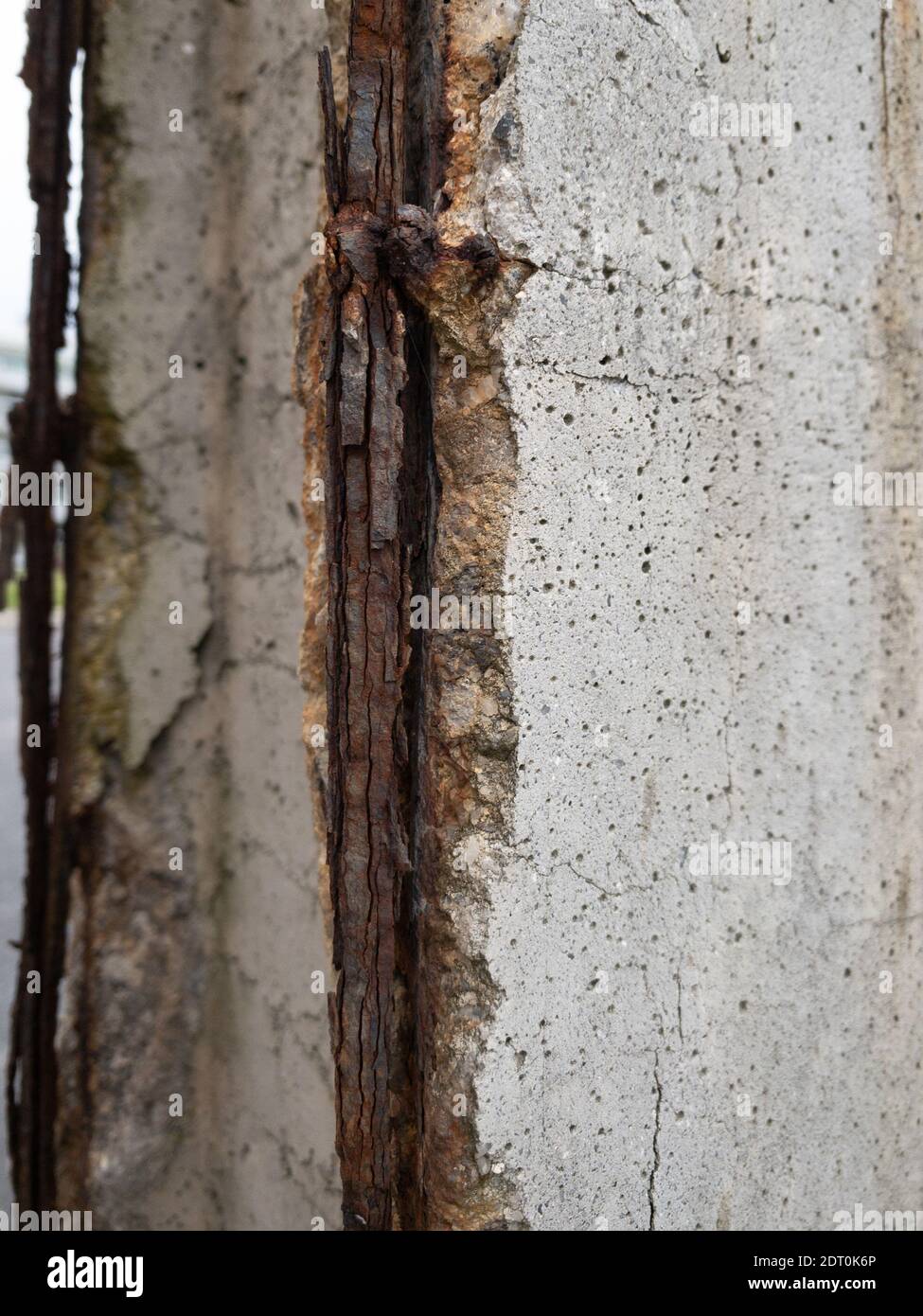 A vertical shot of rusted metal on the body of a transmission tower ...
