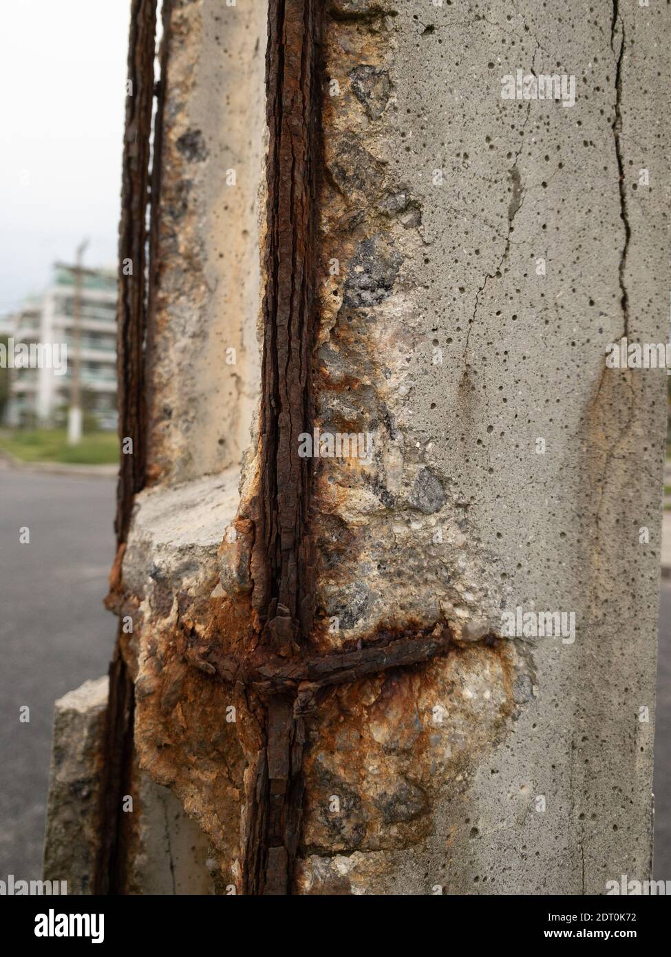 A vertical shot of rusted metal on the body of a transmission tower ...