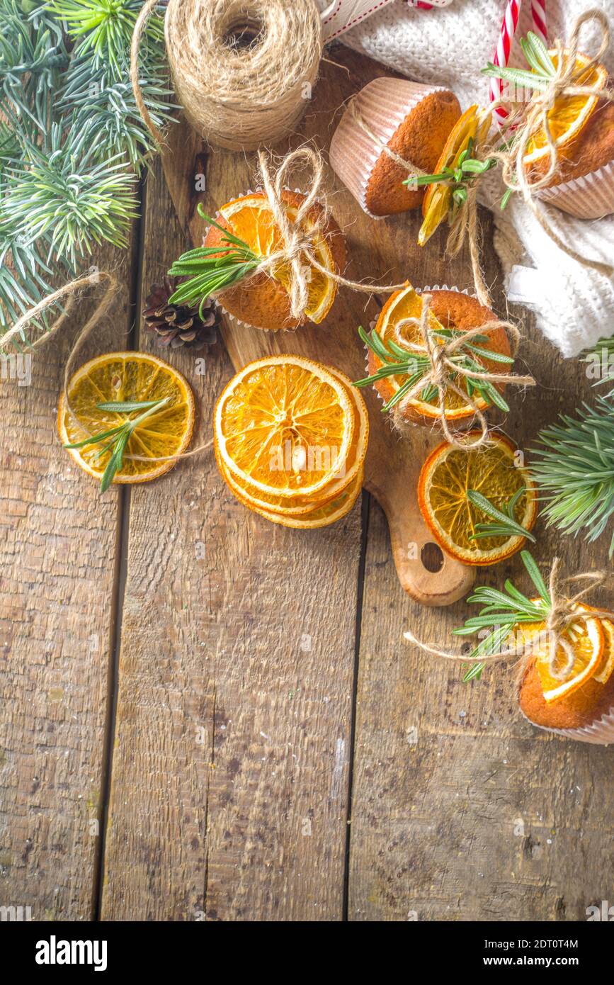 Winter christmas homemade baking recipe. Spicy muffins, orange cupcakes ...
