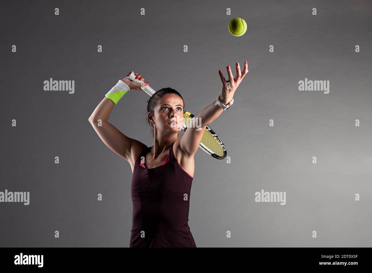 Professional female tennis player. Girl swinging racket Stock Photo - Alamy
