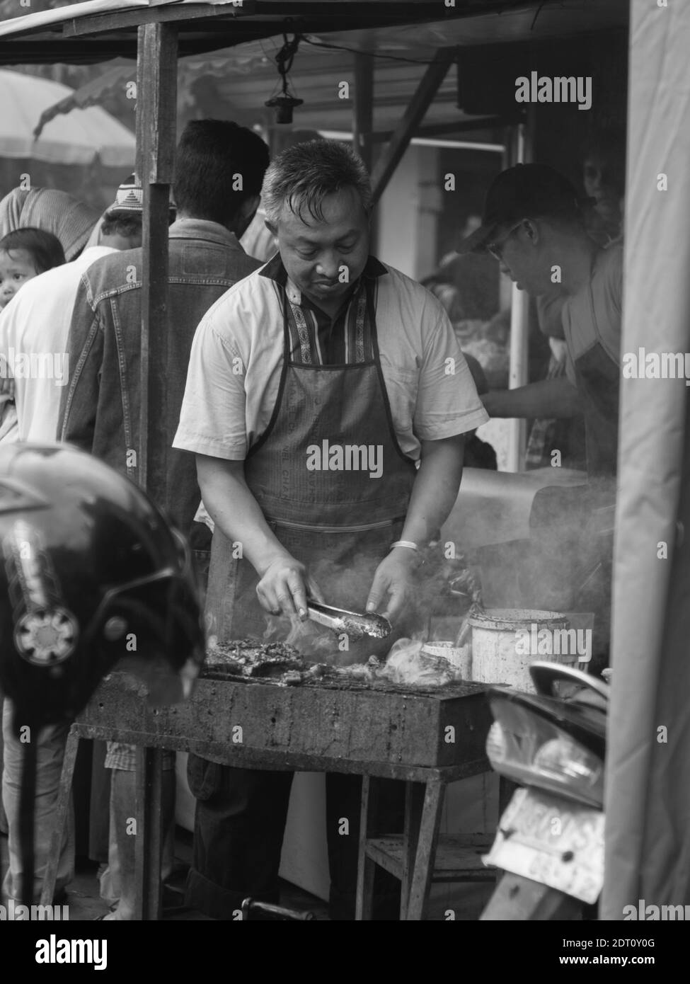 Man barbecuing Black and White Stock Photos & Images - Alamy