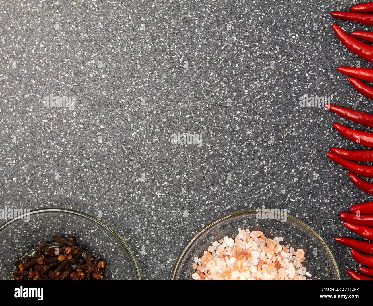 Capsicum and spices on a marble board top view Stock Photo - Alamy