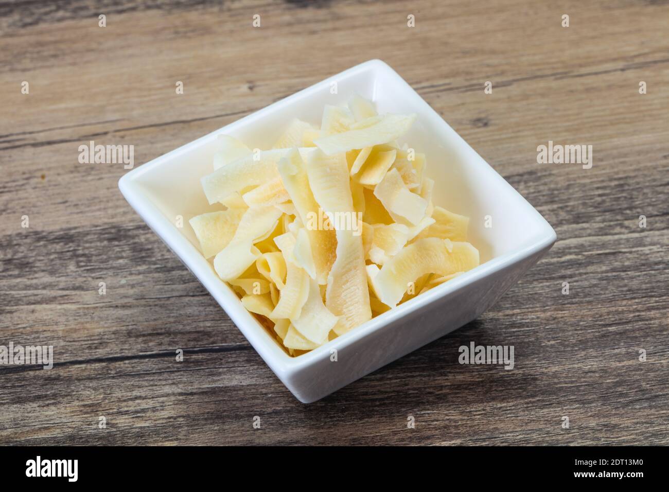 Coconut dry chips snack in the bowl Stock Photo - Alamy