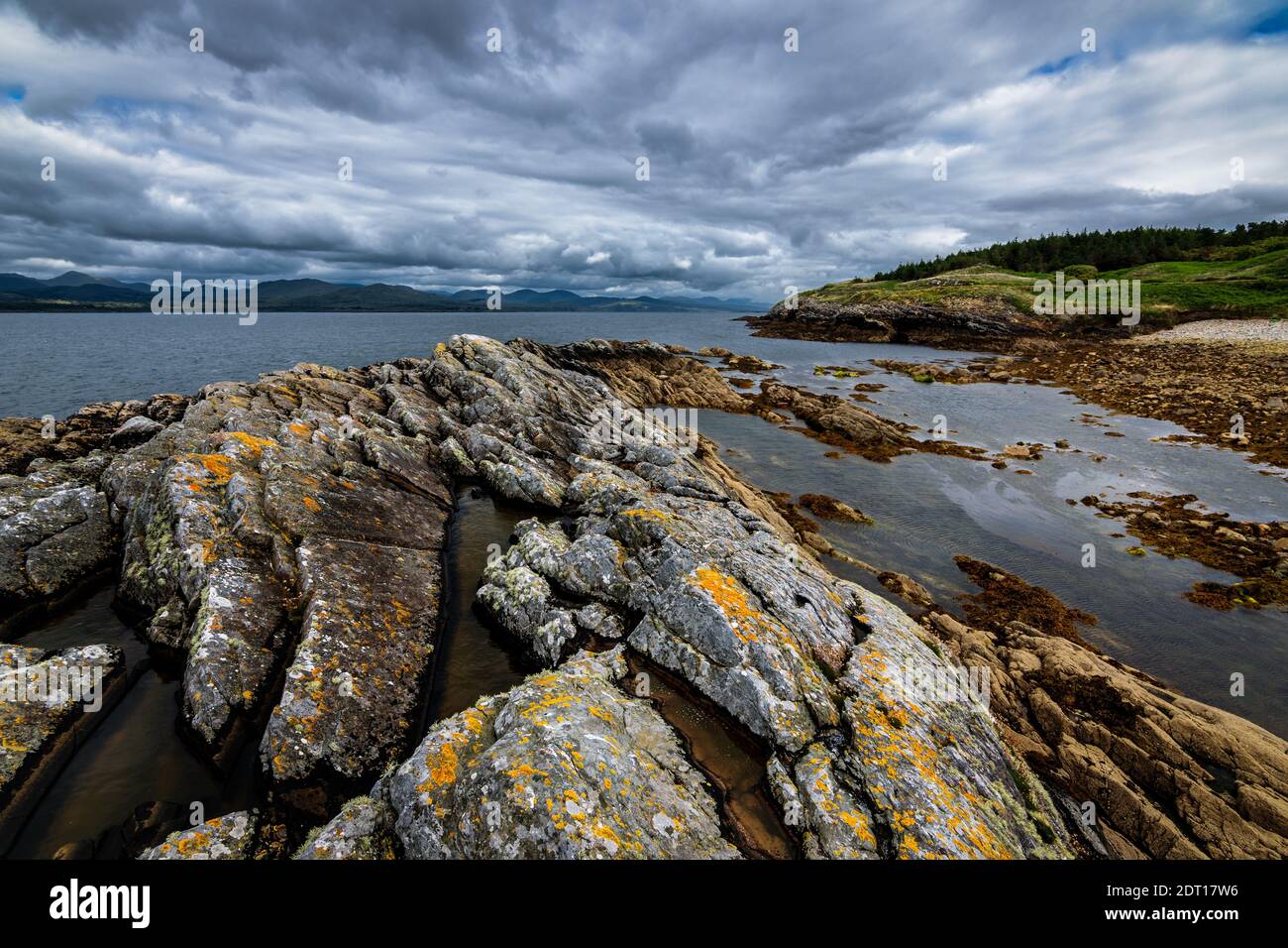 Atlantic ocean, dramatic sky and rocky shoreline of Ireland on the West ...