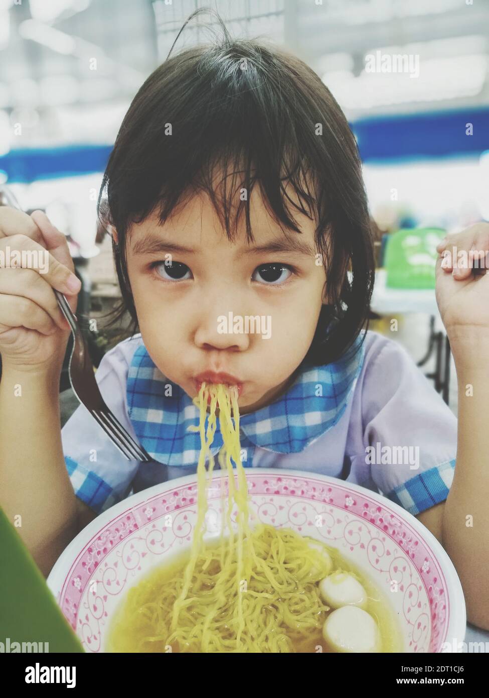 Chinese girls eating noodles hi-res stock photography and images - Alamy