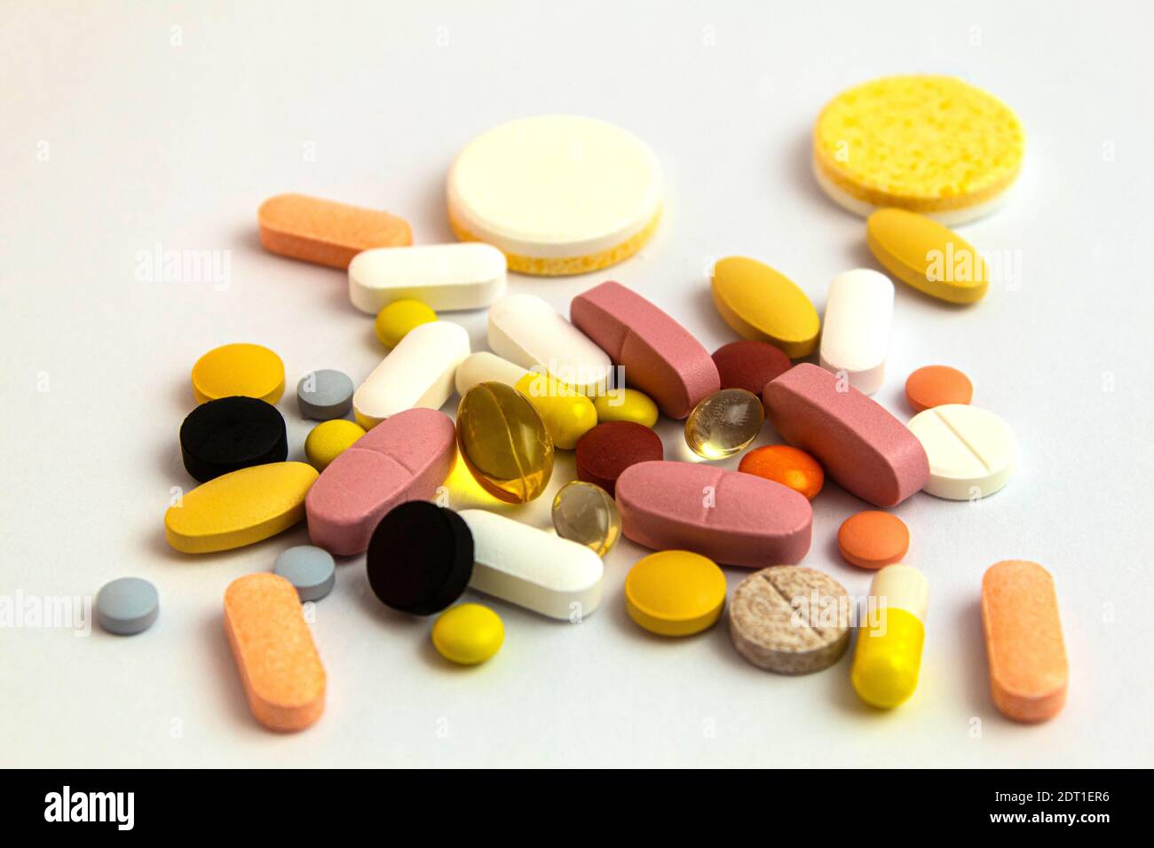 Tablets of different colors and sizes on a white background Stock Photo ...